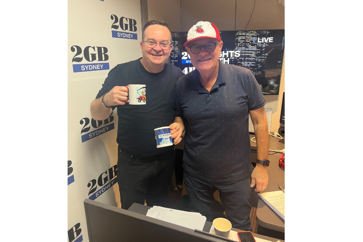 John and Rob exchange personalised mugs